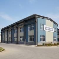 China Commercial / Industrial Steel Framed Construction Corrosion Resistant Prefab Steel Buildings for sale
