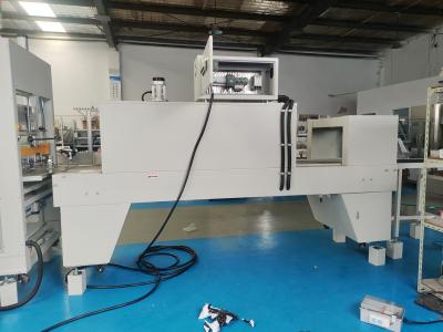 China Automatic Water Pet Bottle PE Film Heat Tunnel Sleeve Wrap Shrink Machine with Automatic Membrane Film Sealer for sale