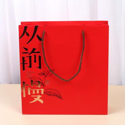 China Gold Foil Red Matt Laminated Kraft Paper Shopping Bags With Handles for sale