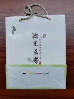 China Matt Laminated 250gsm Kraft Paper Merchandise Bags With Nylon Rope Handle for sale