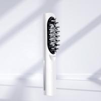 China ABS Plastic Handle Portable Scalp Massager Comb with Negative Ion and Micro Current for sale