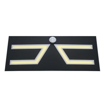 China IP65 White Black Sensitive Pir Cob Solar Powered Outside Wall Lights for sale
