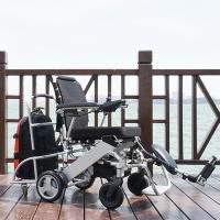 China Brushless Portable Foldable Electric Wheelchair Lithium Battery Lightweight With 300W Motor for sale