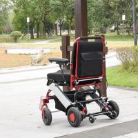 China Brush Motor Light Foldable Electric Wheelchair With Rigid PU Tyre for sale
