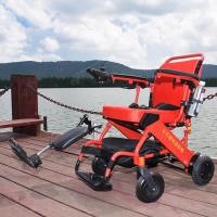 China Red Lightweight Compact Wheelchair Foldable Maximum 6km/H for sale