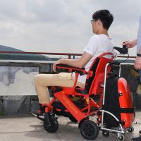 China Red Lightweight Compact Wheelchair Foldable Maximum 6km/H for sale
