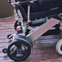 China Multifunction Handicapped 300W Battery Electric Wheelchair for sale
