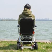 China 100KG Load Folding Electric Wheelchair 6km/hr With Lithium Ion Battery for sale