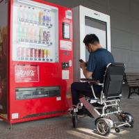 China Brushless Motor Power Wheelchair Aluminum Alloy With Rigid PU Tyre for sale