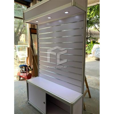 China Cellphone Accessories Freestanding Slatwall Display Units With Lockable Sliding Door for sale