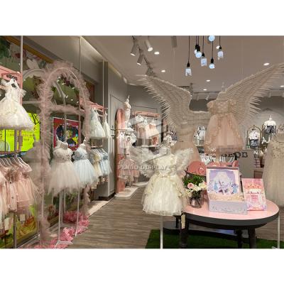 China Marble Powder Coated Kids Clothing Shop Display Furniture for sale