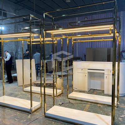 China Golden Luminous Clothing Diplay Stand For Garment Shop Furniture for sale