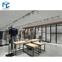 China Black Golden Color Wooden Clothes Display Rack For Shop Interior Design for sale