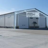 China Large Clear Span Steel Warehouse Building 60m Column Free Portal Frame Logistics Hub for sale