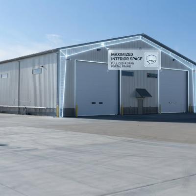 China Large Clear Span Steel Warehouse Building 60m Column Free Portal Frame Logistics Hub for sale