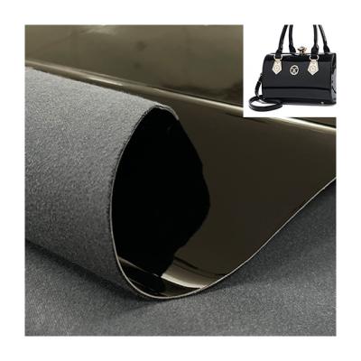 China Premium Mirror Surface PU Leather Material 1.4m Width 0.8mm Thickness Waterproof Wrinkle Resistant for sale