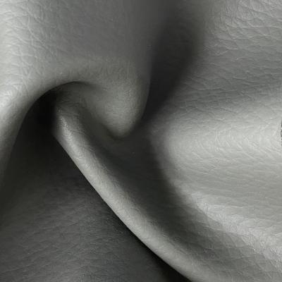 China Premium Litchi Embossed PVC Eco Leather Material 1.5mm Thickness 1.4m Width 31 Colors Available for sale