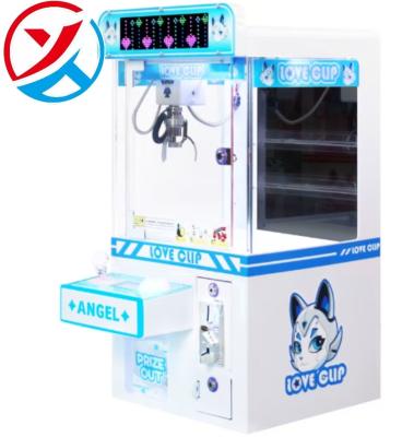 China LED Light Mini Claw Machine Hardware Cabinet With Plush Toys And Keychains for sale