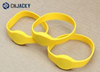 China Water Proof TK4100 Yellow RFID Silicone Wristband , Writable Wristbands for sale