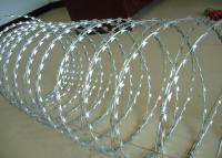 China OD 900mm Concertina Razor Barbed Wire Coiled BTO 22  Galvanized for sale