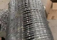 China Electro Galvanized Razor Barbed Wire BTO 22 700MM Coil for sale