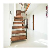 China Wood glass floating staircase price diamond shaped wood curved floating stair for sale