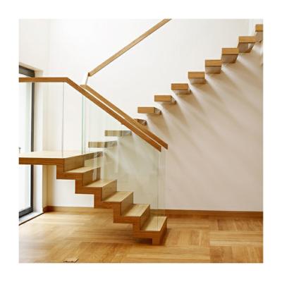 China Oak veneer floating staircase curved wooden staircase black floating stairs for sale