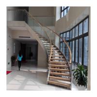 China Timber treads curved staircase decor French Guiana steel round stairway design for sale