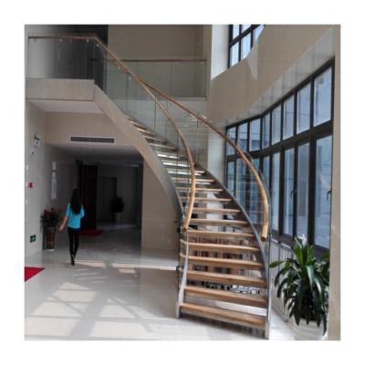 China Timber treads curved staircase decor French Guiana steel round stairway design for sale