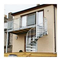 China Decorative metal columns wrought iron rosettes indoor steel spiral staircase for sale
