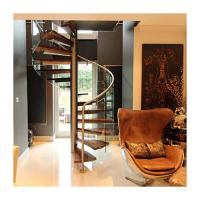 China Single stringer stair rubber wooden tread fitting spiral space saving staircase for sale