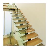 China Townhouse wood staircase with glass railing single stringer solid wood straight stair for sale