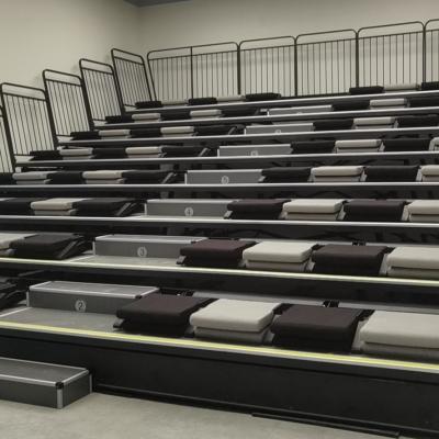China PP Material Retractable Bleacher Seating with Sofa Cushion and Rear Folding Design for Studio Meeting Room for sale
