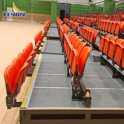 China Electric Telescopic Retractable Bleacher Seating with Riser Mounted Folding Chairs and Waterproof Finish for Gym for sale