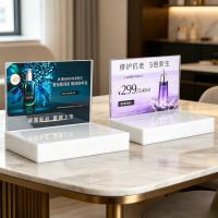 China L-shaped product display stand, transparent acrylic cosmetic display rack with lights, skin care product shelf for sale