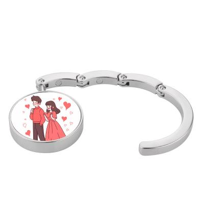 China Diy Photo Print Bag Hooks Dye Heat Transfer Print Sublimation Blank Metal Hook Bag Hanger For Table for sale