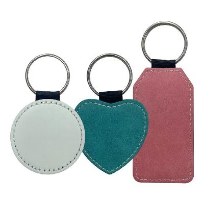 China PU Sublimation Heart Keychain Blank Custom Logo Double Side Printing Sublimation Leather Keychain for sale