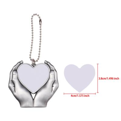 China Creative Christmas Ornament Heart In Hands Sublimation Car Charm Pendants Blanks For Heat Press for sale