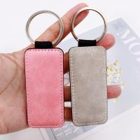 China Waterproof Double Sided Rectangle Sublimation Leather Keychain Blanks for sale