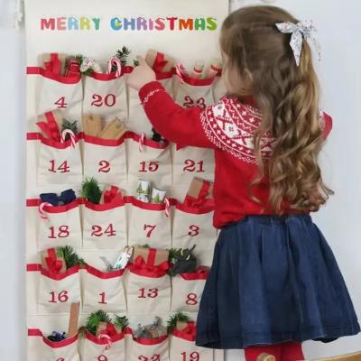 China Sublimation Cotton Linen Christmas Advent Calendar With Multiple Pockets Diy Wall-Mounted Canvas Storage Bag For Xmas Holiday Festival for sale