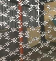 China Galvanized Pvc Stainless Steel Concertina Razor Barbed Tape Bto-22 Bto-60 Cbt-65 In Fencing for sale