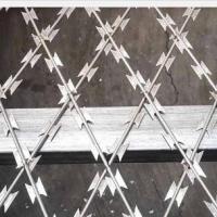 China Galvanized Security Fencing Concertina Price Anti Climb Blade Barbed Wire Prison Razor Barbed Wire for sale