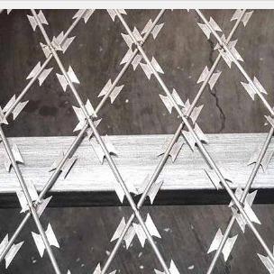 China Galvanized Security Fencing Concertina Price Anti Climb Blade Barbed Wire Prison Razor Barbed Wire for sale