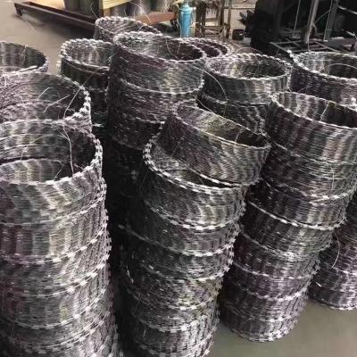 China Powder Coated Galvanized Concertina Coil , Concertina Barbed Wire Cbt-65 for sale