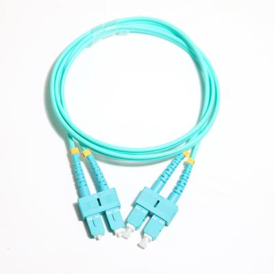 China Duplex Multimode Wathet Fiber Patch Cord SU-UPC Ject 50 / 125um LSZH Jacket 3.0mm OM3 for sale