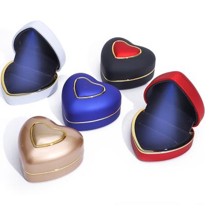 China Custom Heart Shaped LED Jewelry Display Case with Gold Rim for Rings and Bracelets - Plastic Velvet Construction for sale