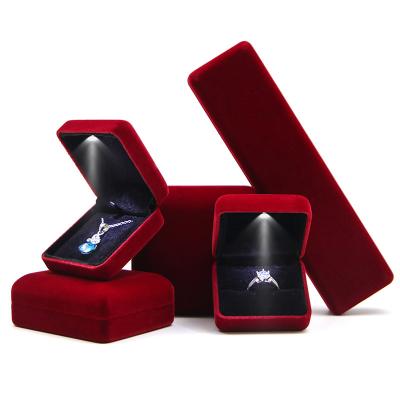 China Luxury LED Jewelry Box with Embossed Hanhong Logo and Red Velvet Interior for sale
