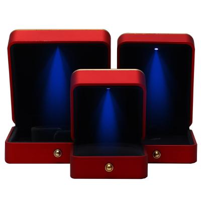 China Custom Plastic Spray Painted Square LED Jewelry Box with Red Light for Necklace Ring 10x10x5cm for sale