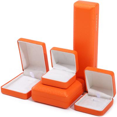 China Custom Logo Rectangle Orange Leather Jewelry Box for Bracelet Necklace Storage 20x15x5cm for sale