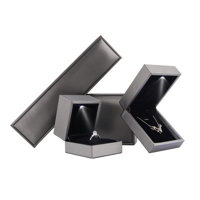 China Custom Logo Brushed Leather LED Jewelry Box with Velvet Interior for Luxury Packaging for sale